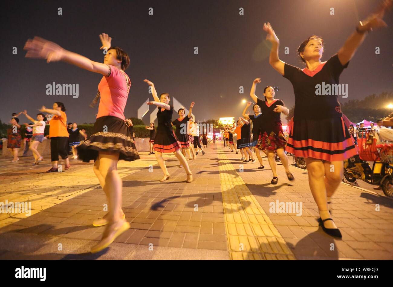 --FILE--Local Chinese women dance on a square in the evening in Huaian ...