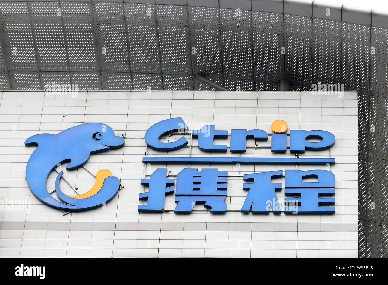 --FILE--View of a signboard of Ctrip at the headquarters of Chinese ...