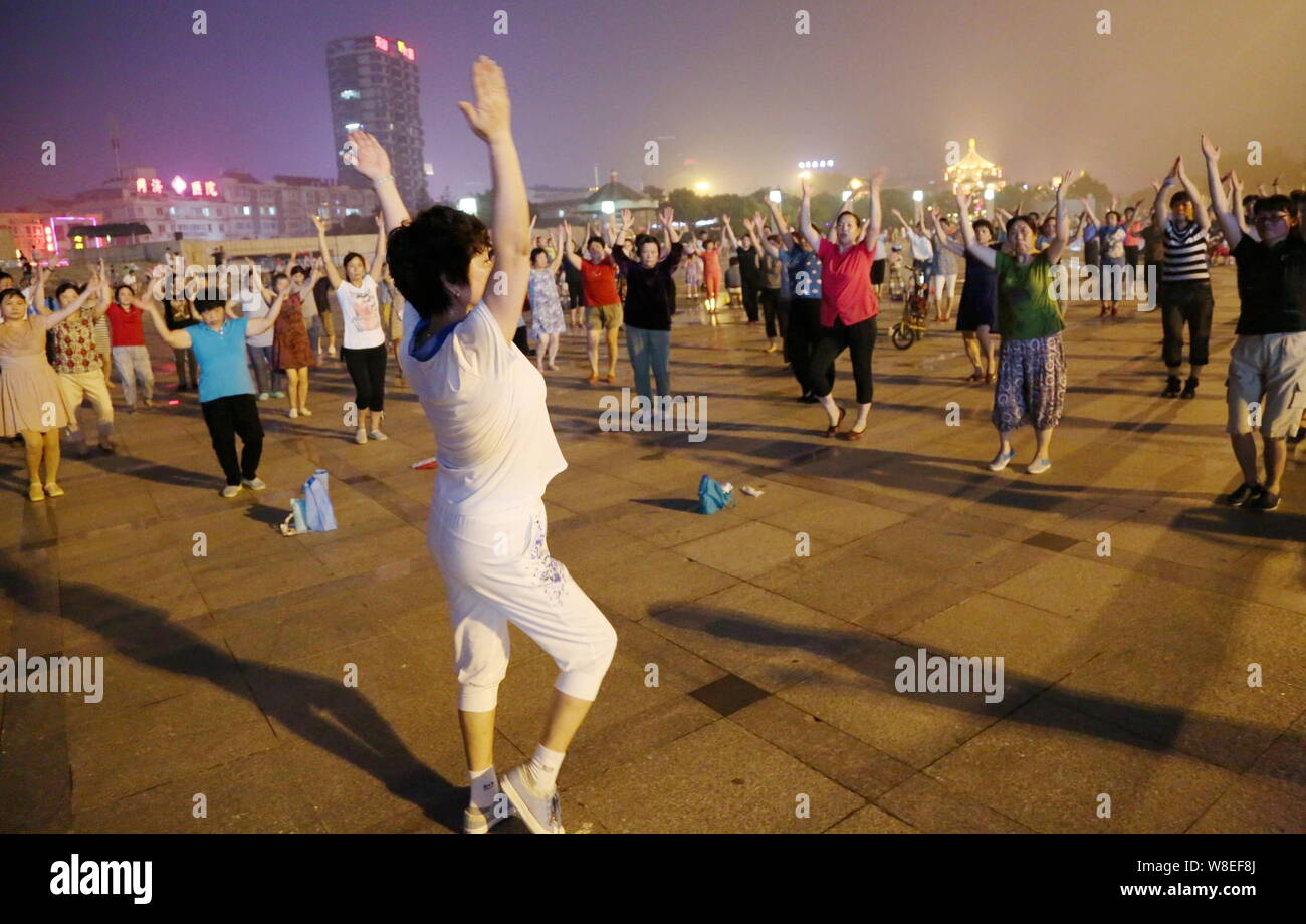 --FILE--Local Chinese women dance on a square in the evening in Huaian ...