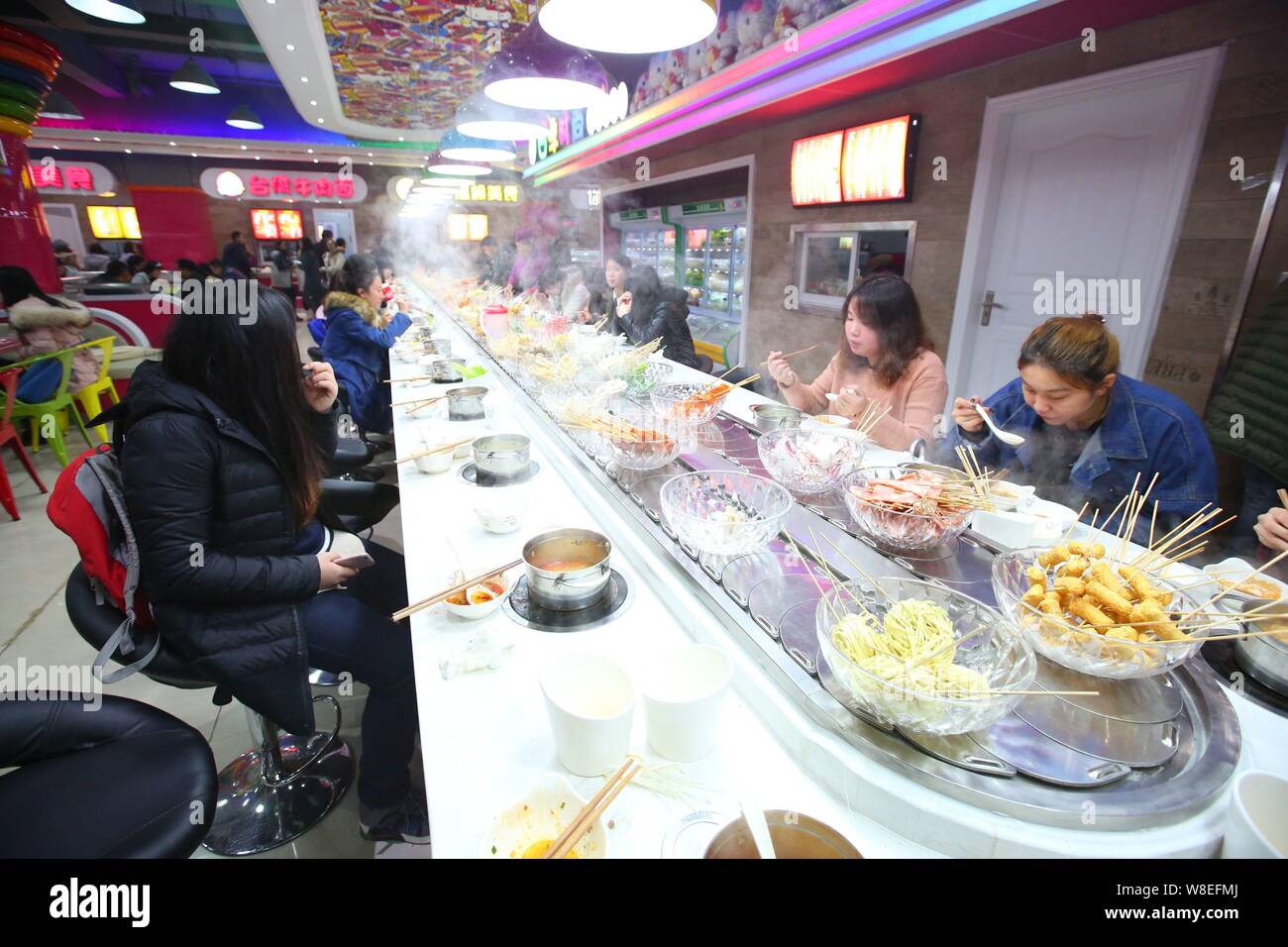 Chinese students eat lunch in the Hello Kitty-themed canteen at ...