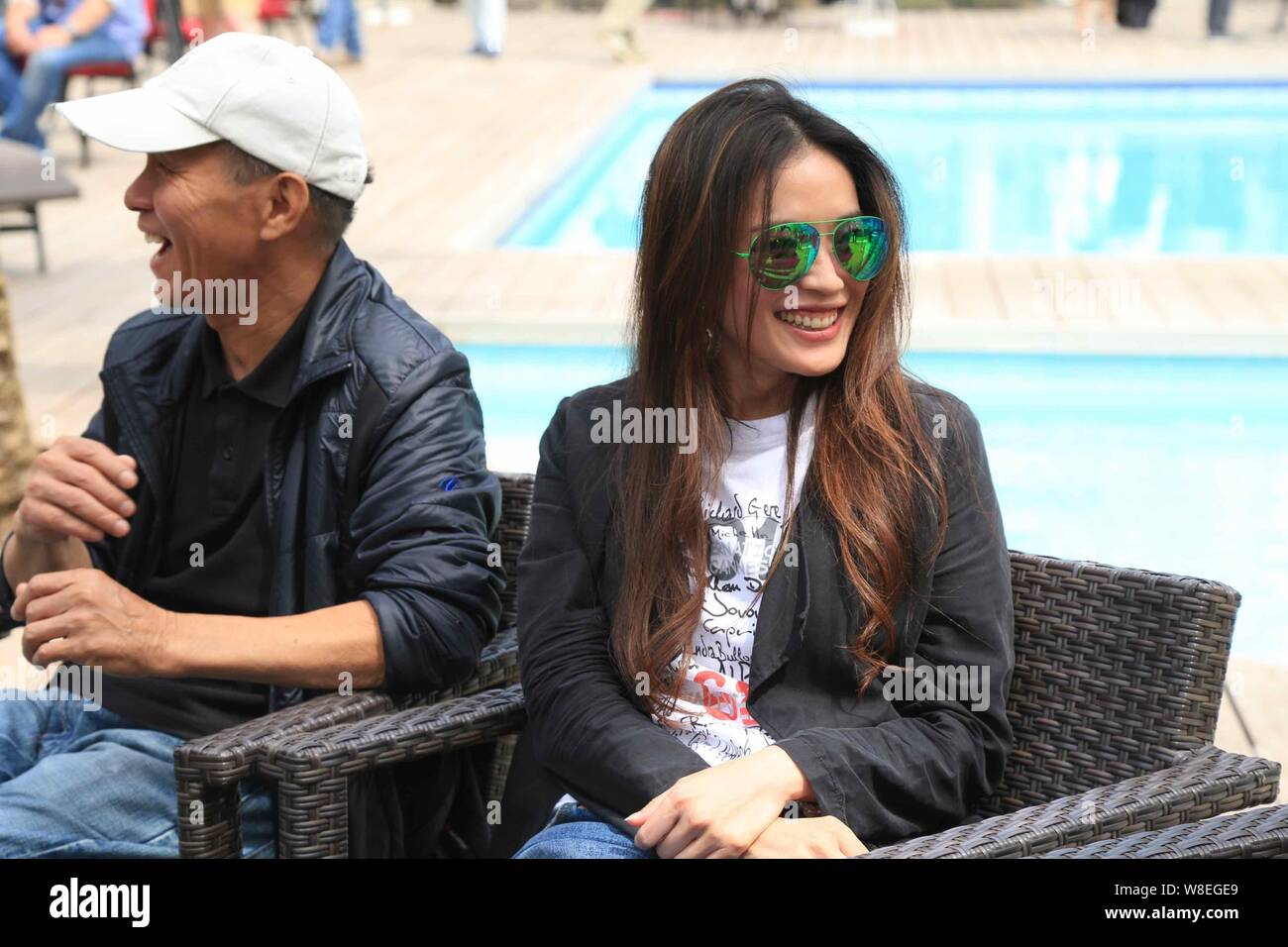 Taiwanese actress Shu Qi, right, smiles at a photocall for her movie ...