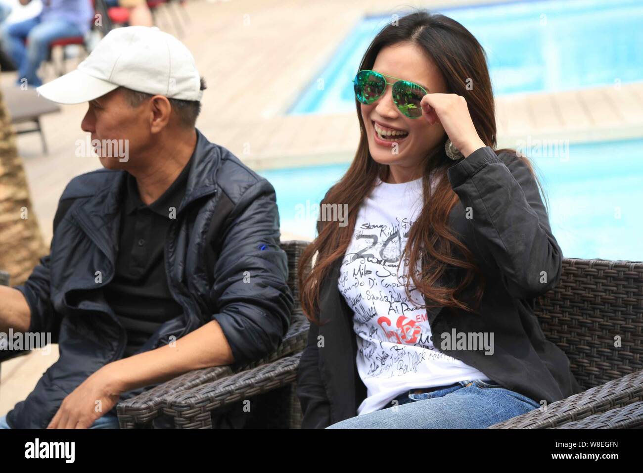 Taiwanese actress Shu Qi, right, smiles at a photocall for her movie ...