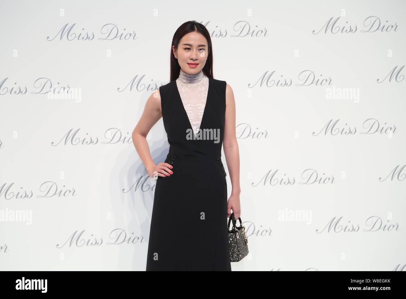 Chinese actress Michelle Ye Xuan poses as she arrives for an opening ...