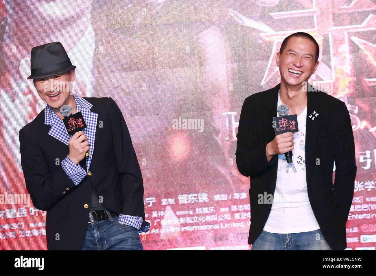Hong Kong singers and actors Jacky Cheung, left, and Nick Cheung react ...