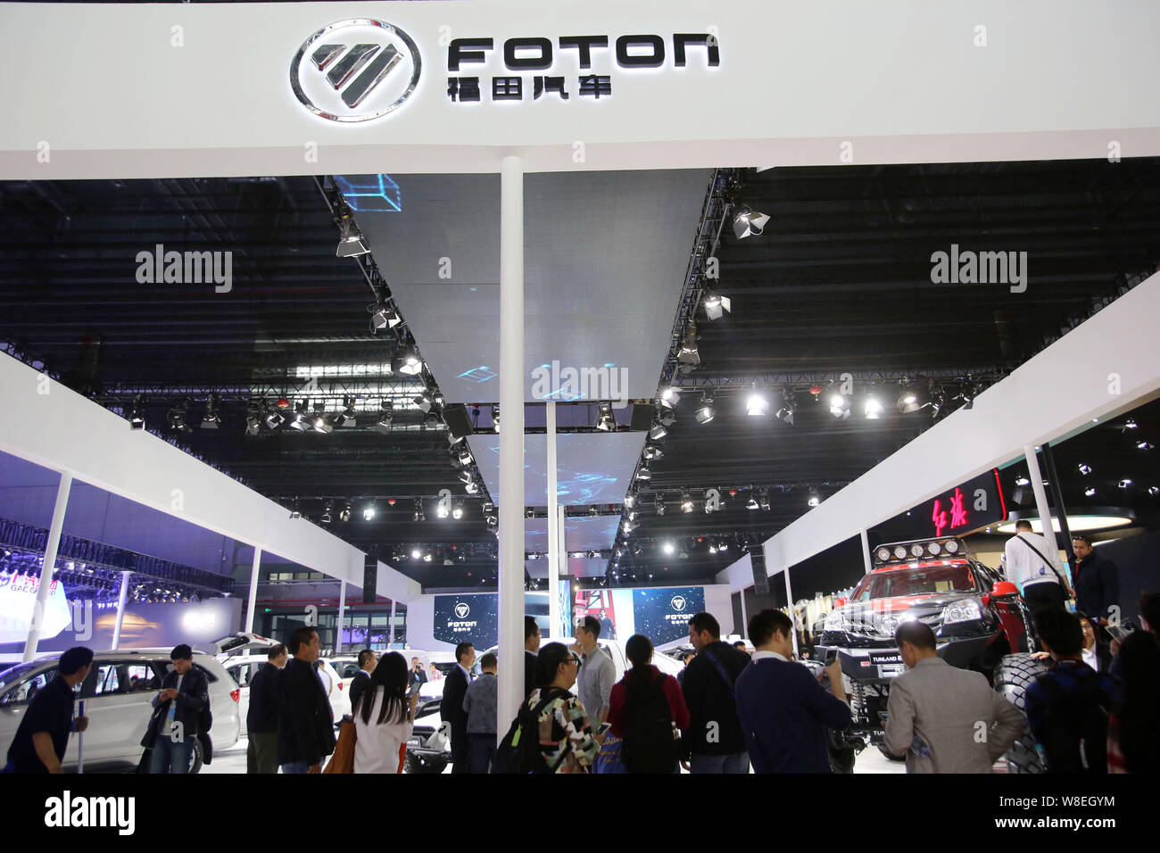 --FILE--People visit the stand of Foton Motor, also known as Beiqi ...
