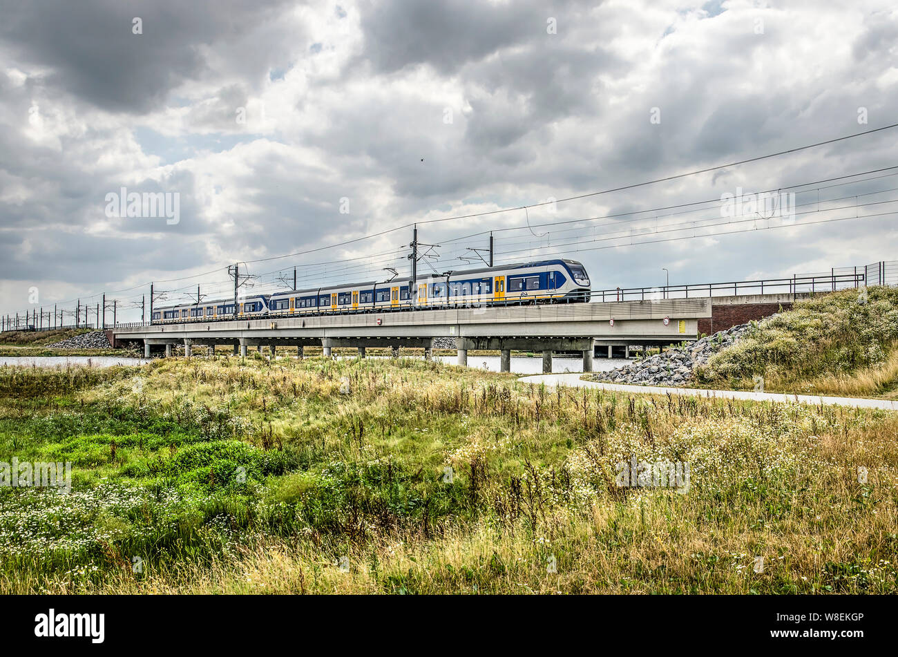 Kampen, The Netherlands, July 29, 2019: Dutch Railways sprinter train ...