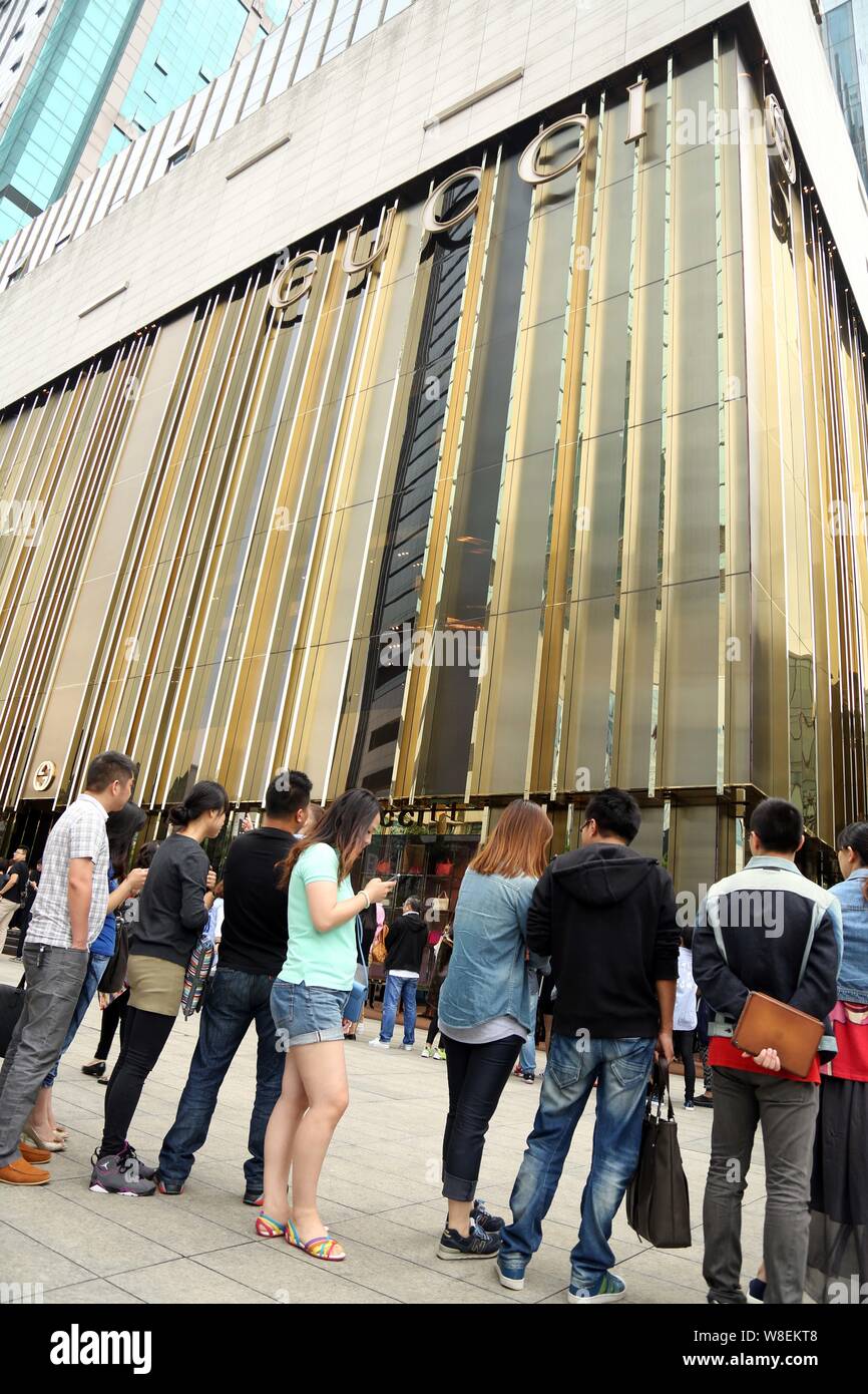 --FILE--Customers queue up outside a Gucci boutique in Shanghai, China ...