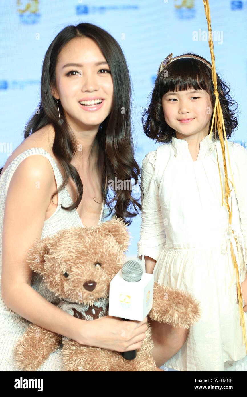 Chinese model and actress Zhang Zilin, left, smiles at a celebration ...