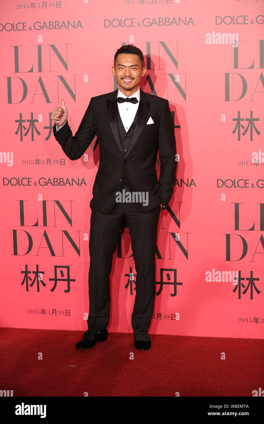 Chinese badminton star Lin Dan poses during the Dolce & Gabbana ...