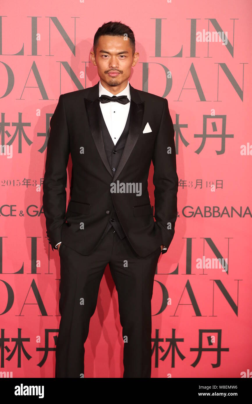 Chinese badminton star Lin Dan poses during the Dolce & Gabbana ...