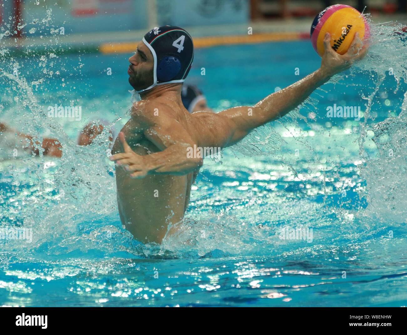 A player of Iran men's national water polo team competes against ...