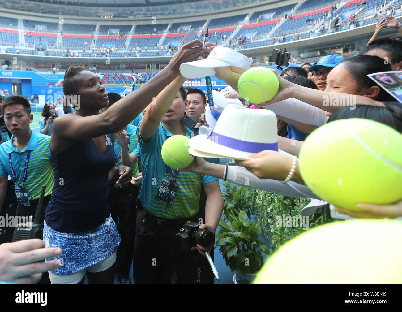 Venus Williams of the United States signs autographs for fans after ...