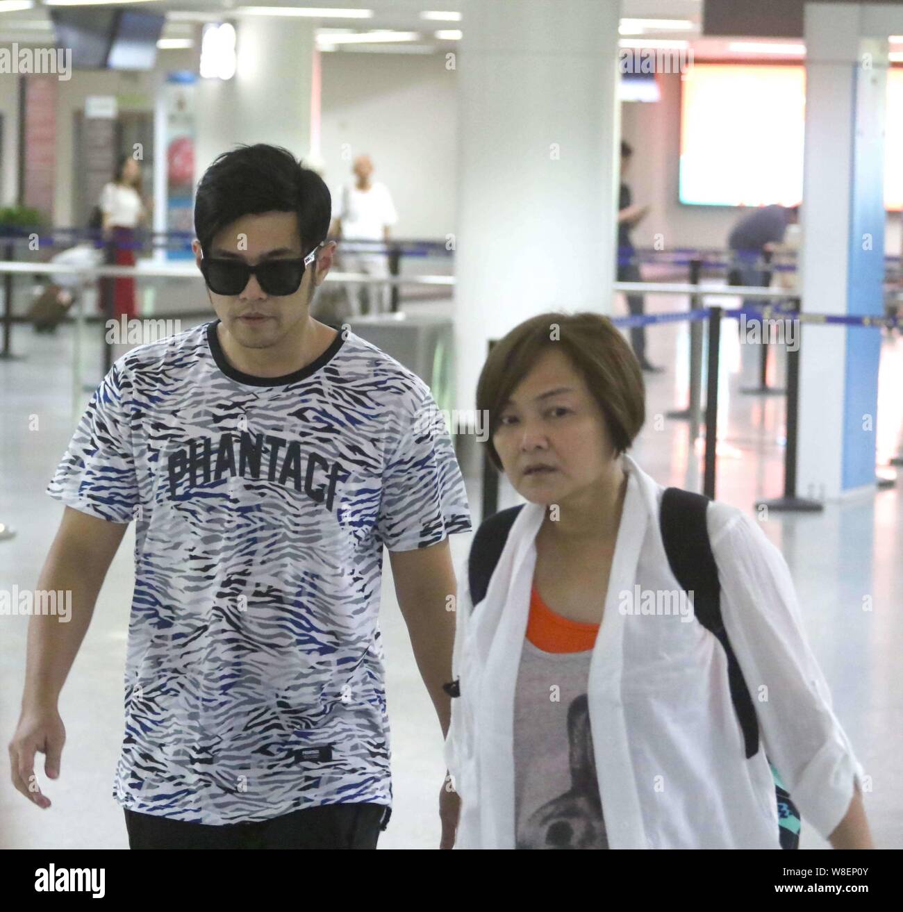 Taiwanese singer Jay Chou, left, is pictured after arriving at the ...