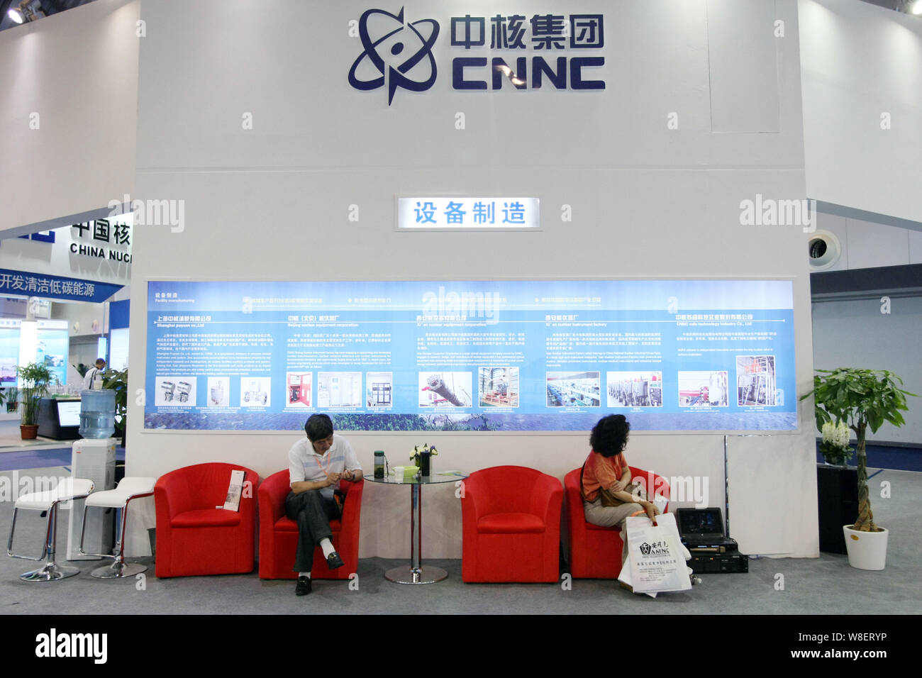 --FILE--Visitors rest at the stand of CNNC (China National Nuclear ...