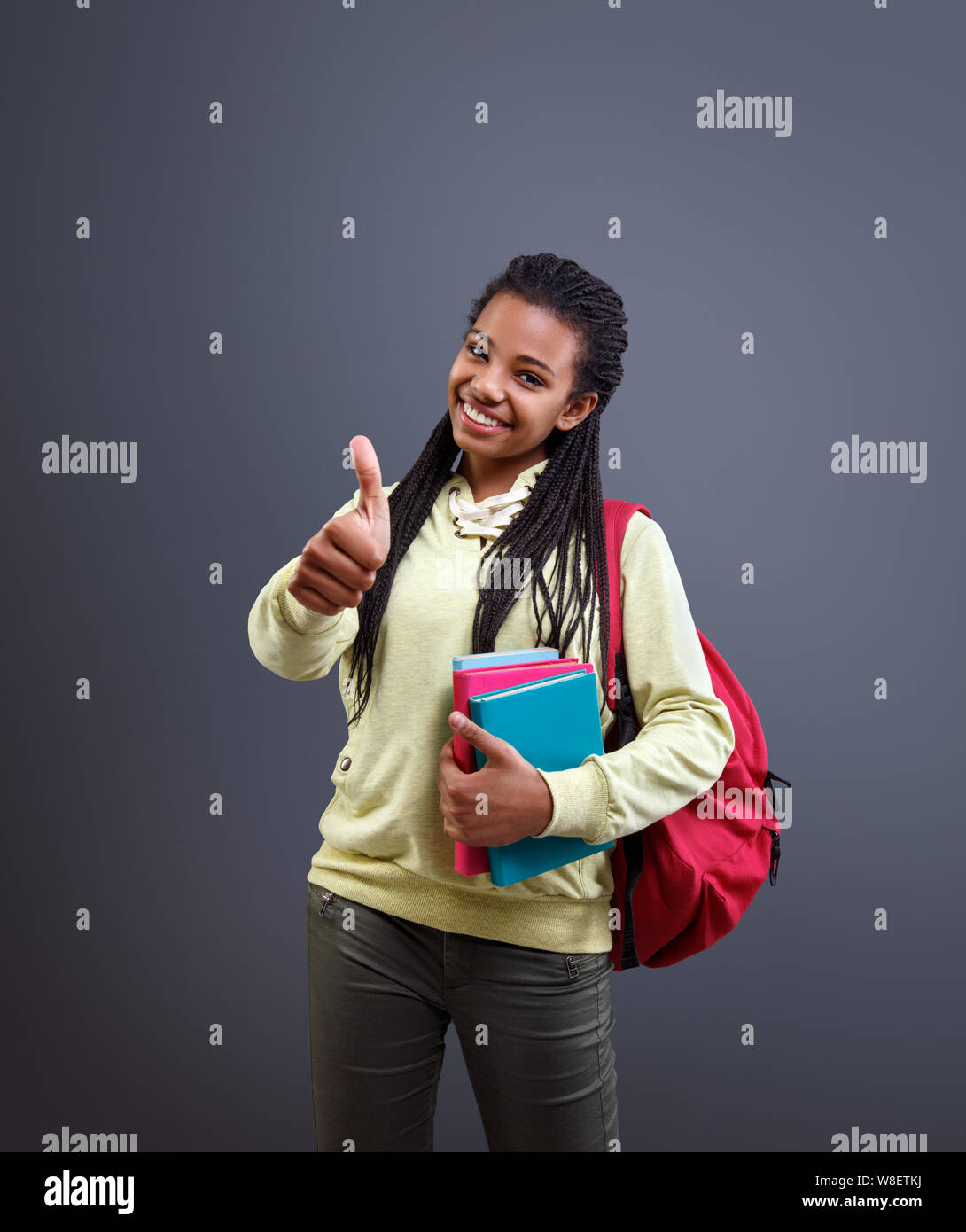 Young Afro-American school child show thumb up for beginning new school ...