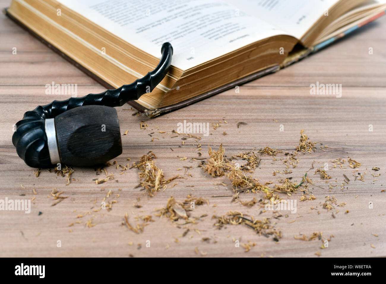 pipe, old book on the table Stock Photo - Alamy