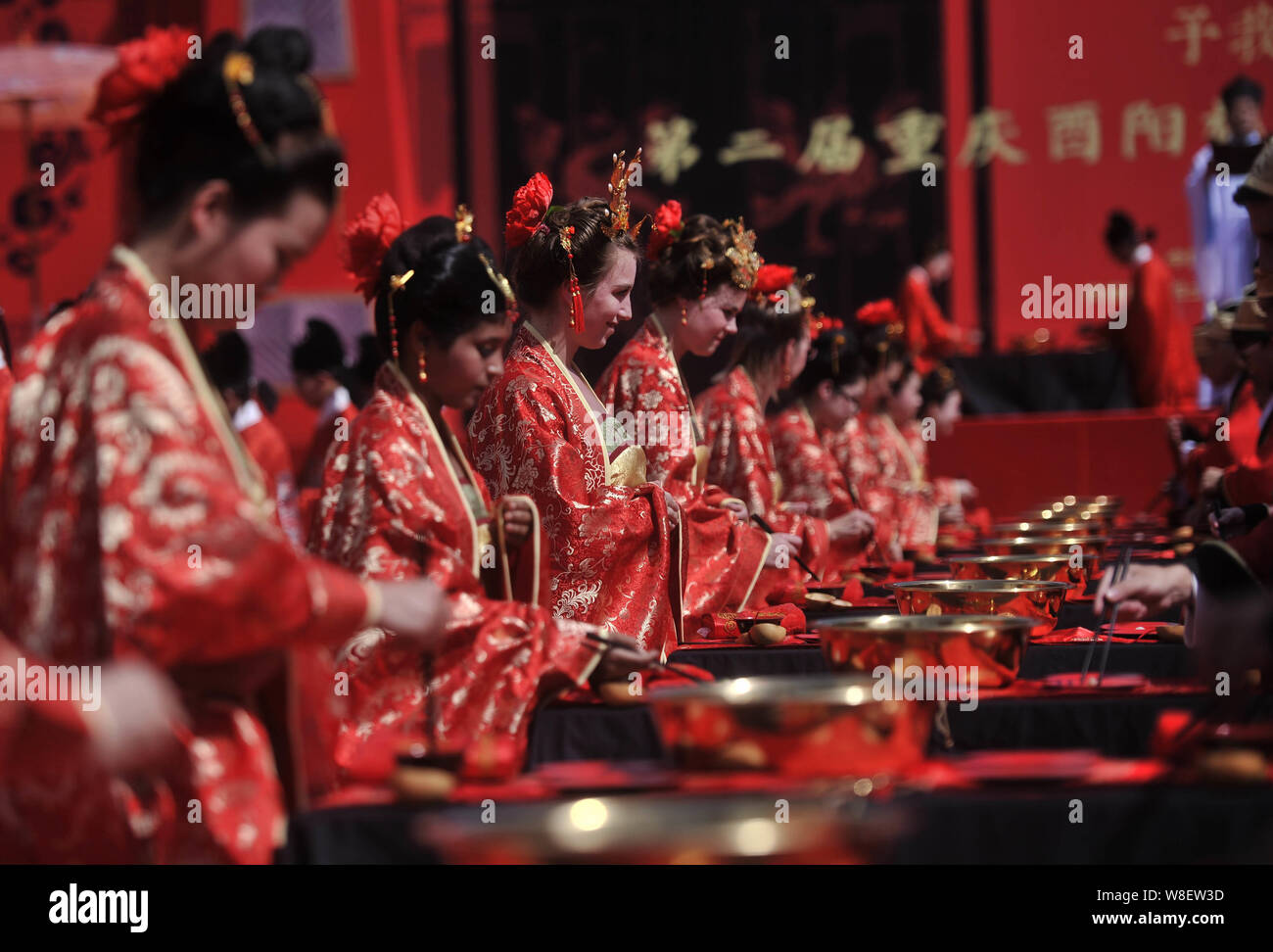 Couples of Chinese and foreign newlyweds dressed in Chinese Han ...