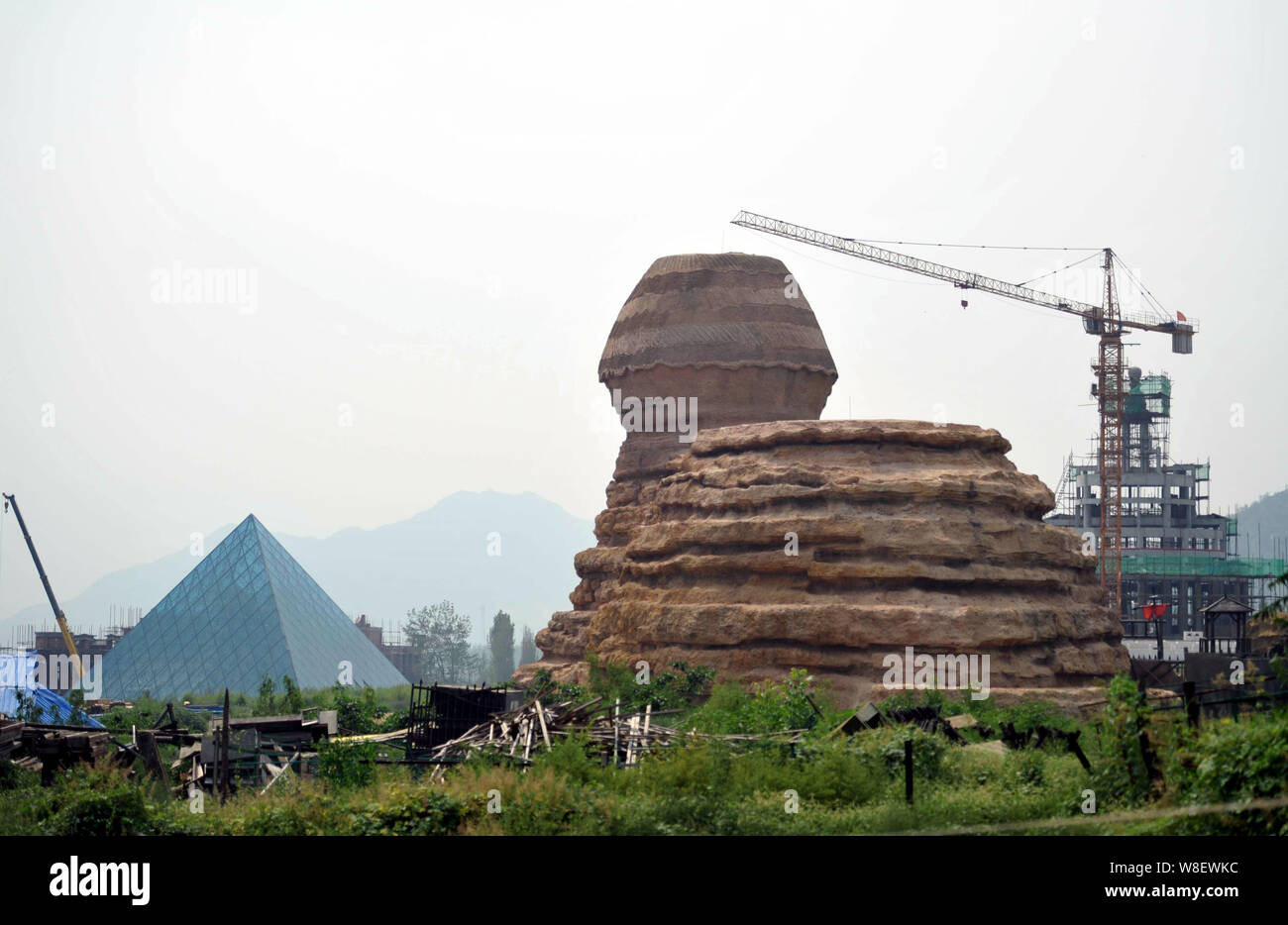 A replica of the glass pyramid at the Louvre Museum, left, is being ...