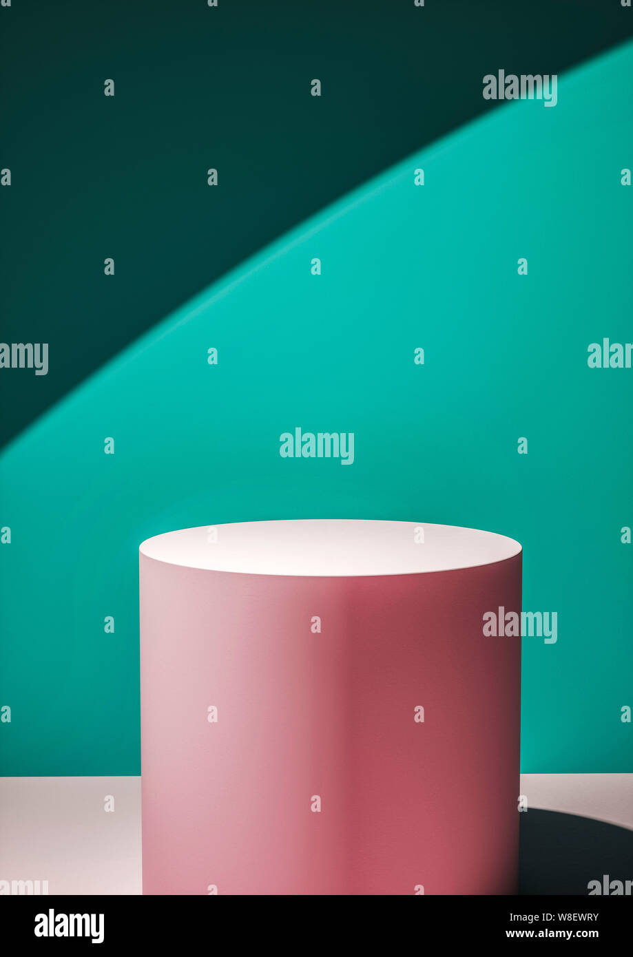Pink circular display plinth against a green wall in a shaft of ...