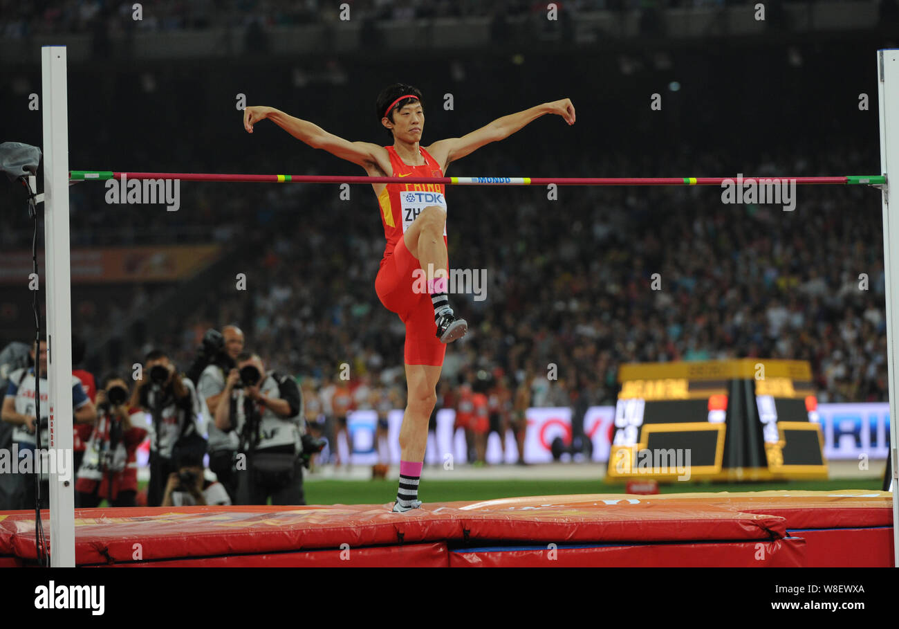 China's Zhang Guowei reacts after clearing the bar in the men's high ...
