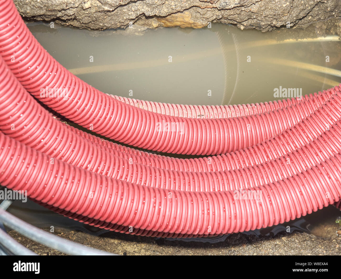 Red plastic tubing underground cable hi-res stock photography and ...