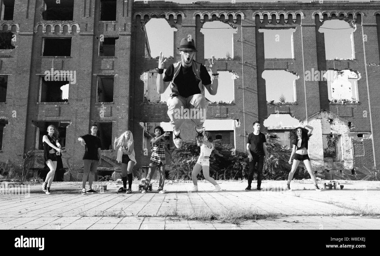 Energetic young hip hop street dancer performing his routine in an ...