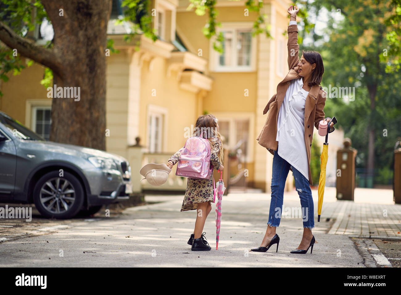 happy Parent taking child to school. Back to school Stock Photo - Alamy
