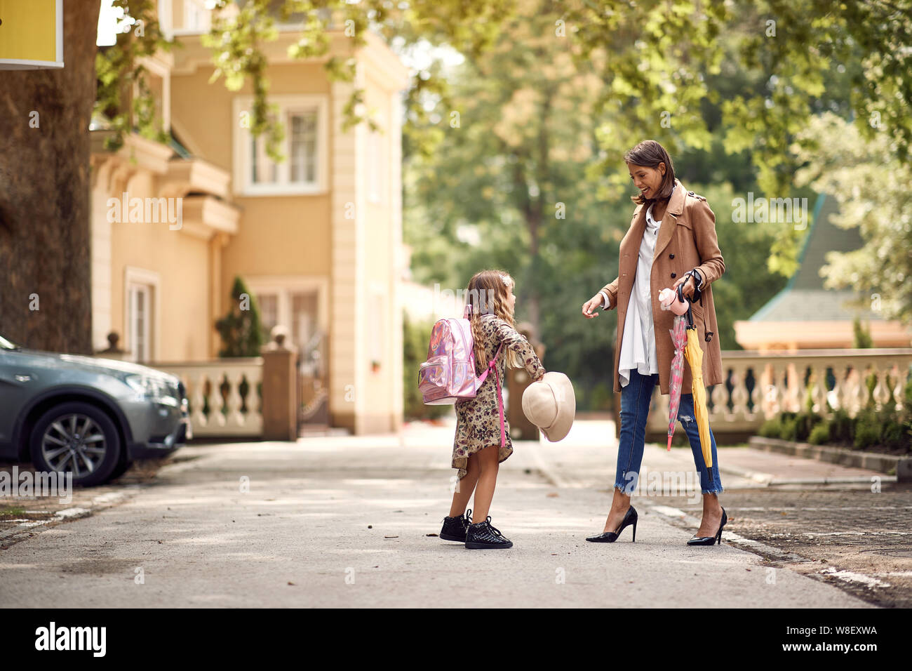 Young parent helping their little child get ready for school Stock ...