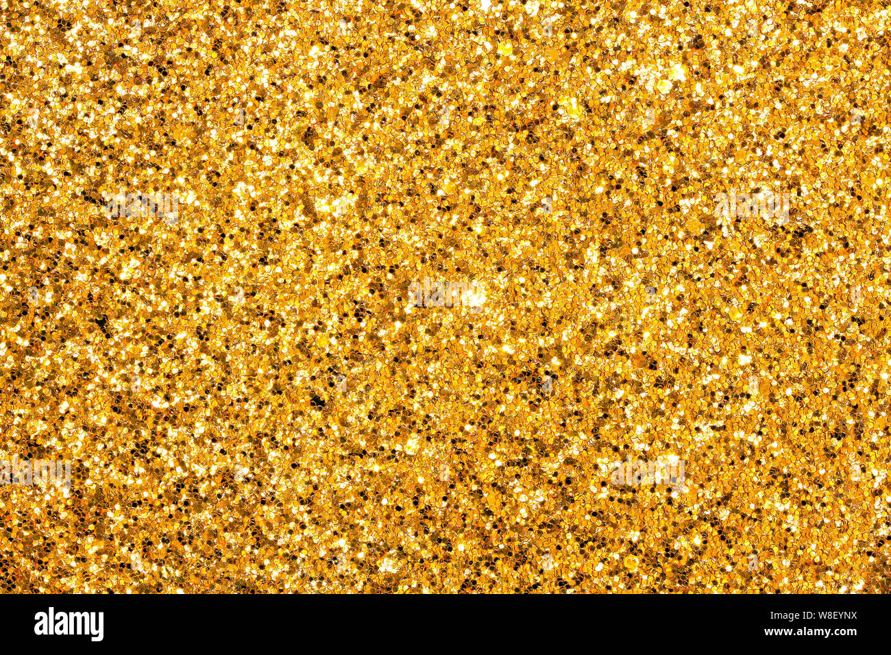 Detailed texture of glittering golden dust surface Stock Photo - Alamy