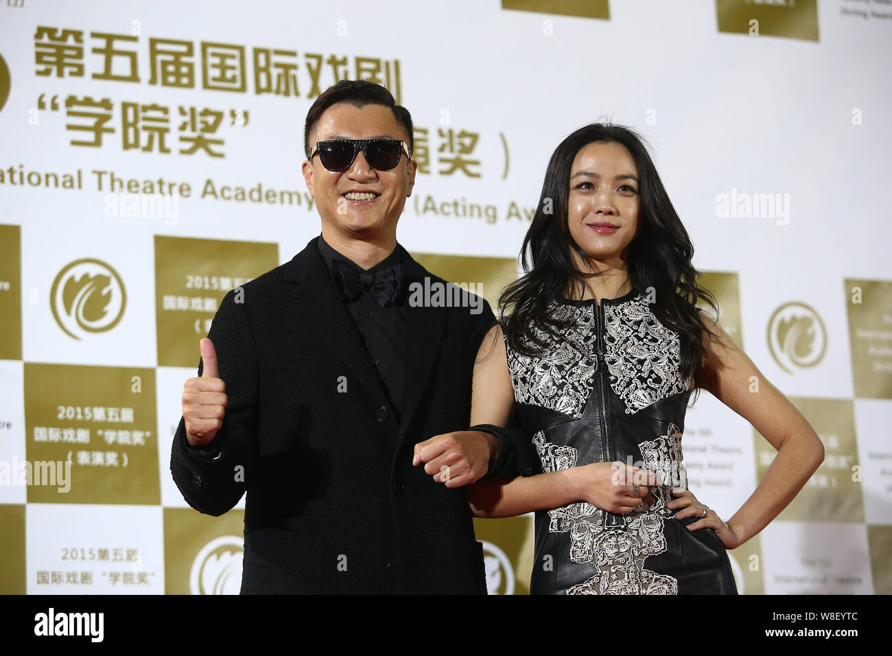 Chinese actress Tang Wei, right, and actor Sun Honglei pose on the red ...