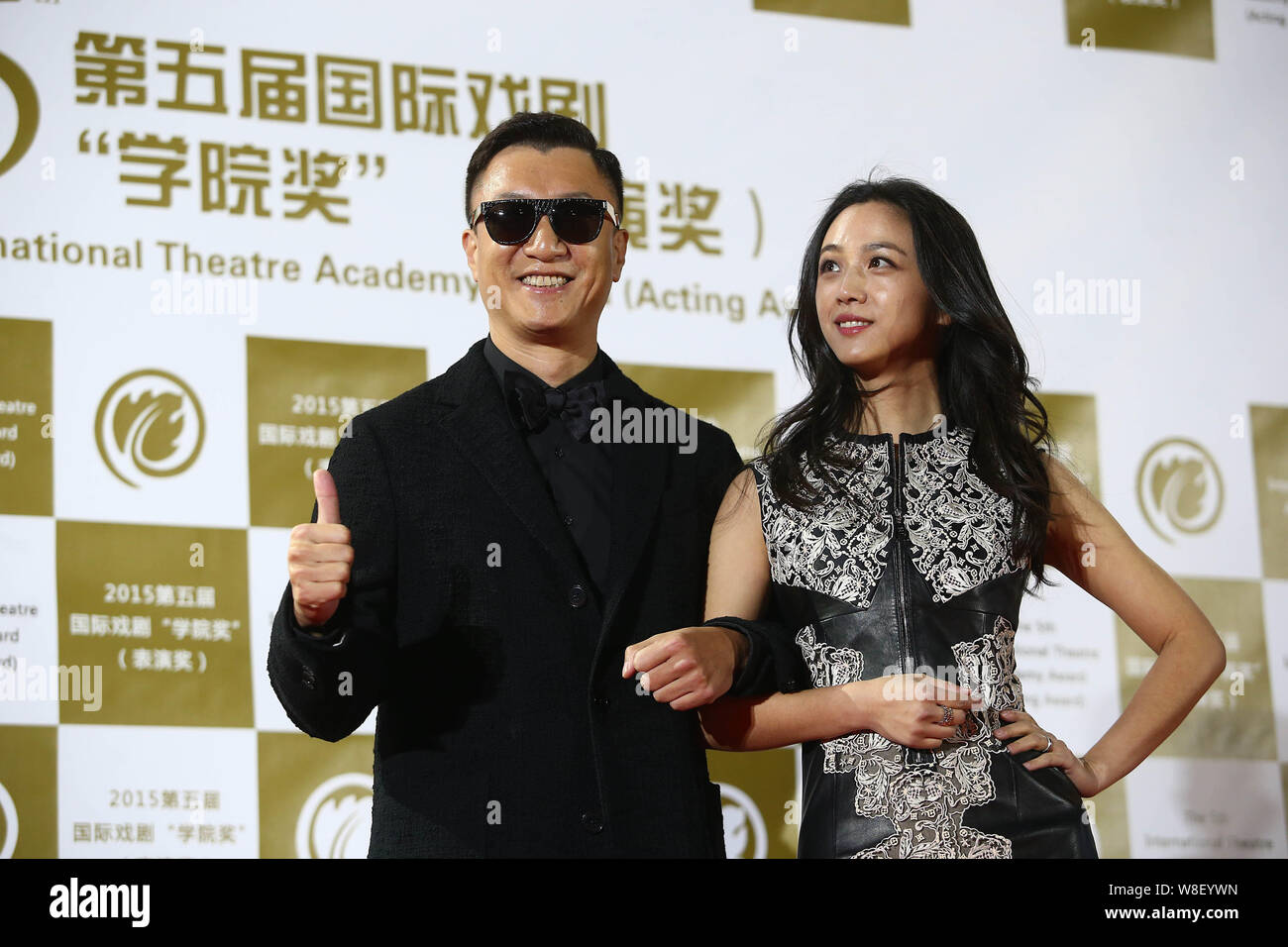 Chinese actress Tang Wei, right, and actor Sun Honglei pose on the red ...