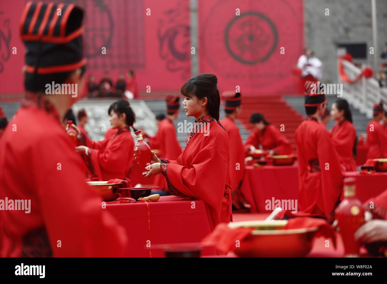 Couples of Chinese newlyweds dressed in traditional Han costumes take ...