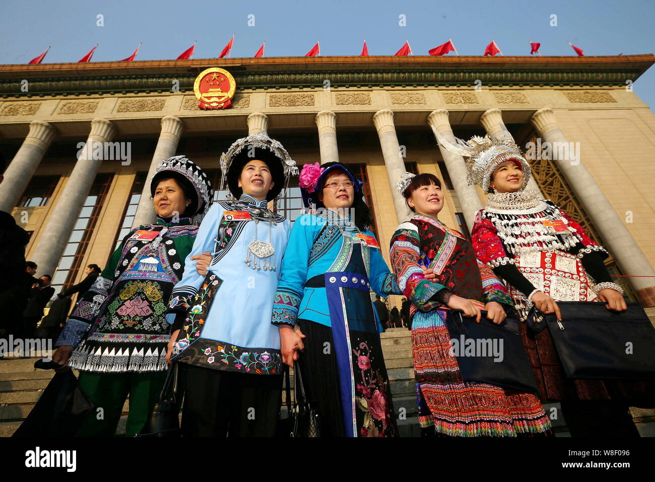 Chinese ethnic minority deputies from Guizhou pose for photos as they ...