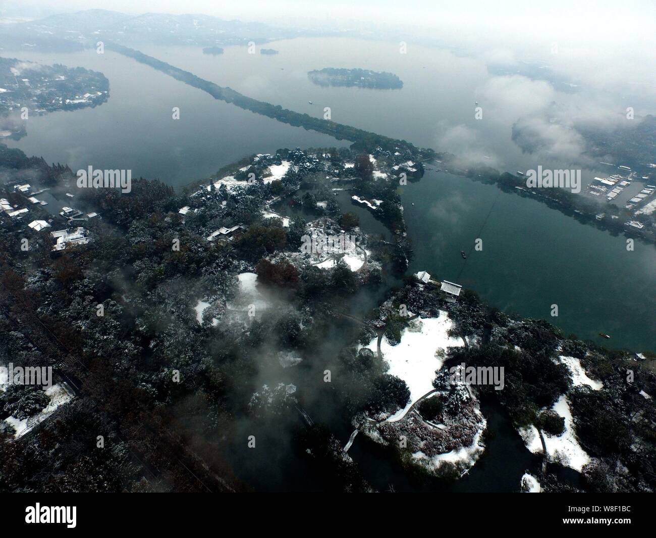 Aerial view of the West Lake in the snow in Hangzhou city, east China's ...