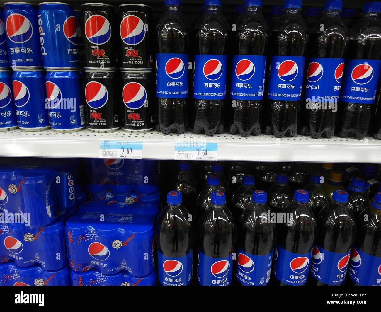 --FILE--Cans and bottles of Pepsi Cola are for sale at a supermarket in ...