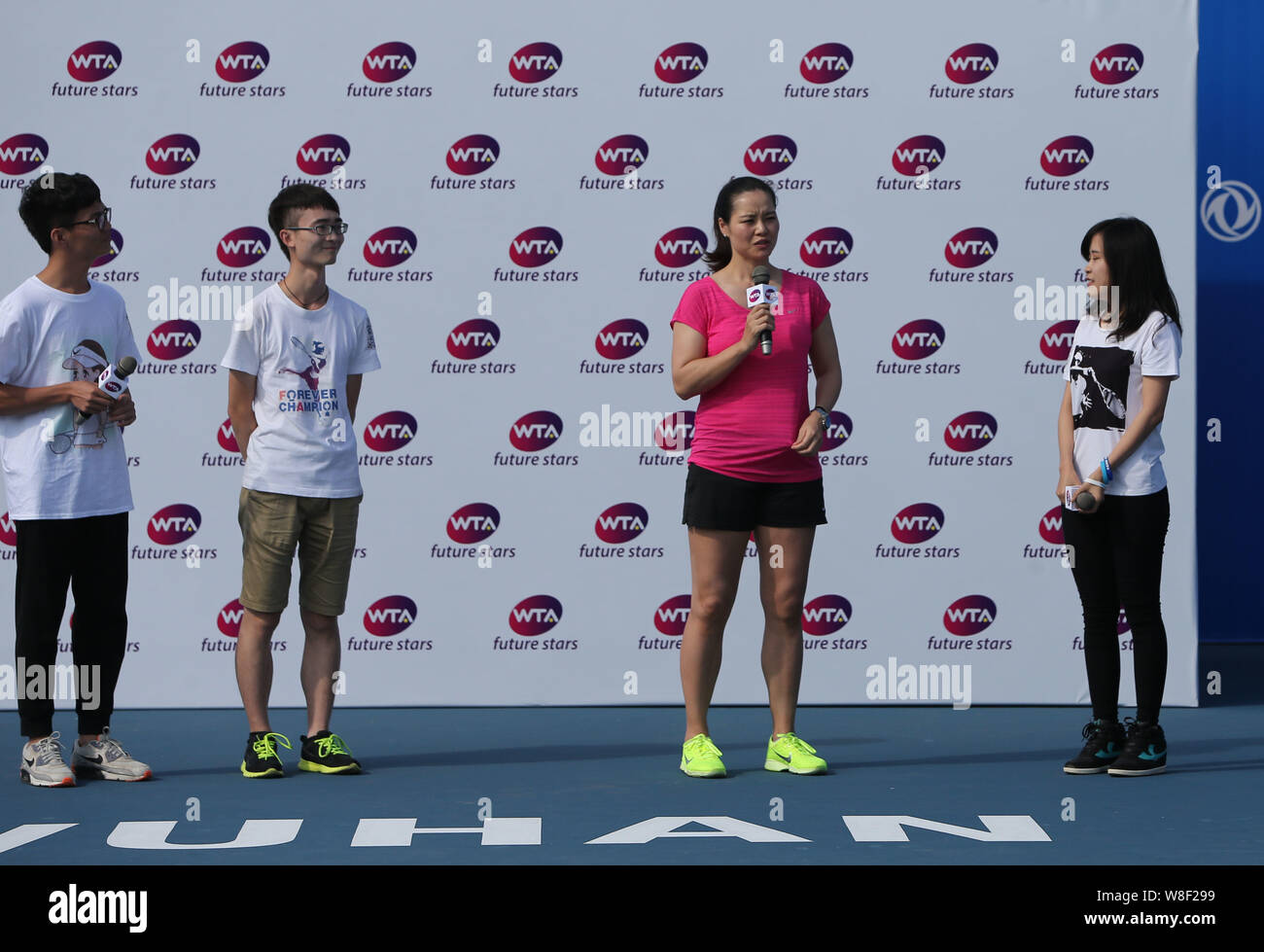 Retired Chinese tennis star Li Na, second right, speaks in a master ...