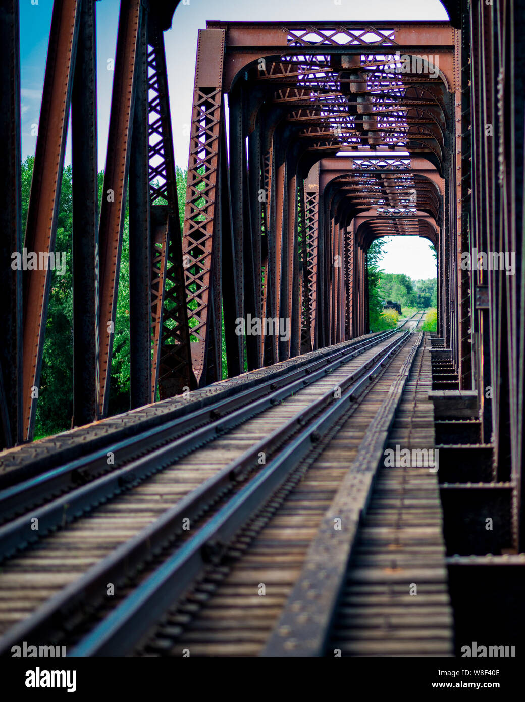 landscape of a railway bridge crossing the river Stock Photo - Alamy
