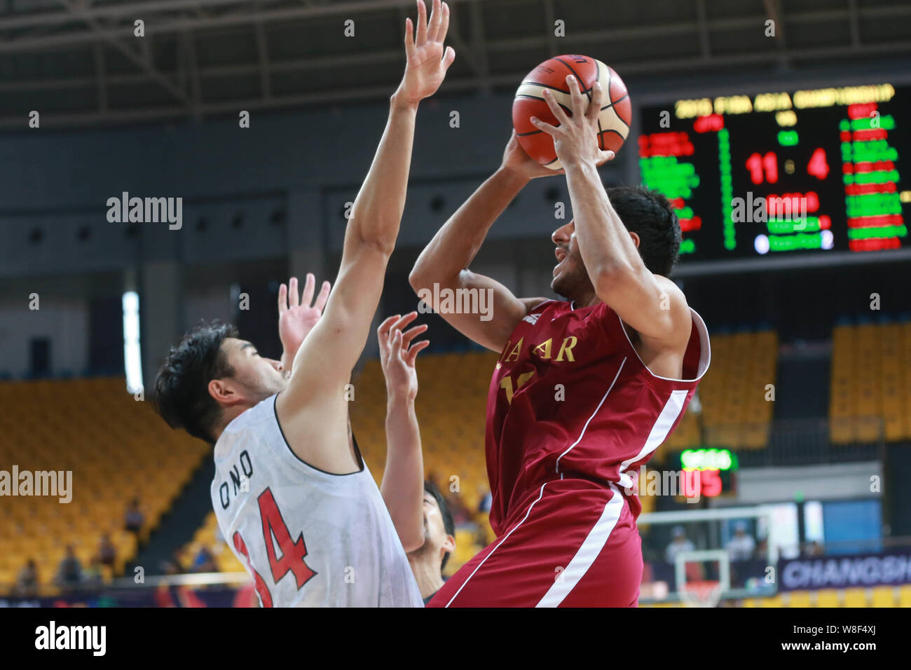 Ryumo Ono of Japan, left, challenges a player of Qatar in a quarter ...