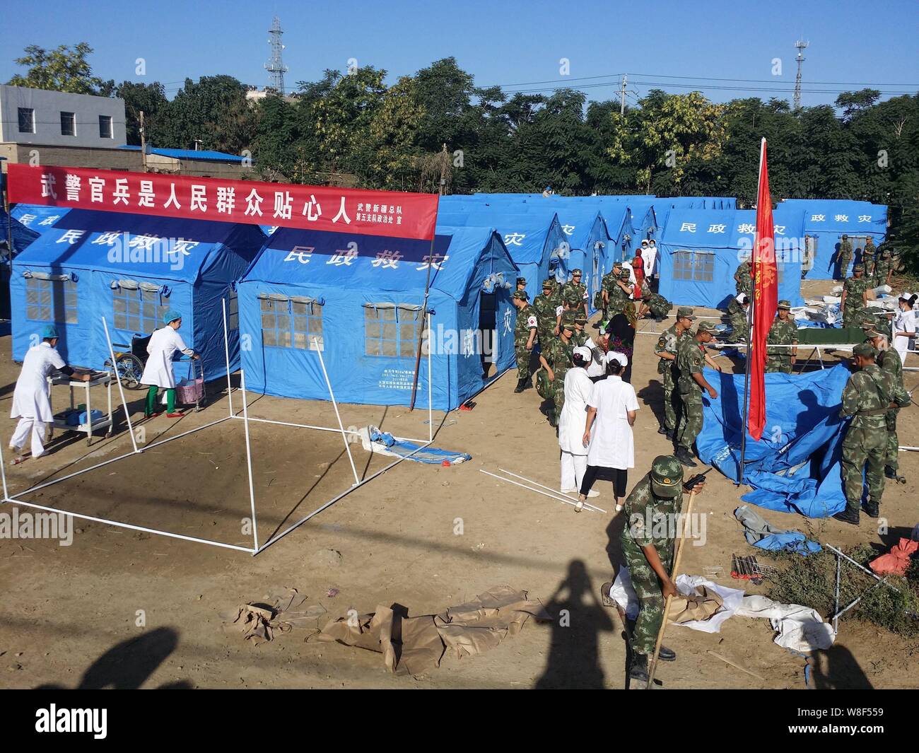Chinese rescuers put up tents for villagers whose houses were ...