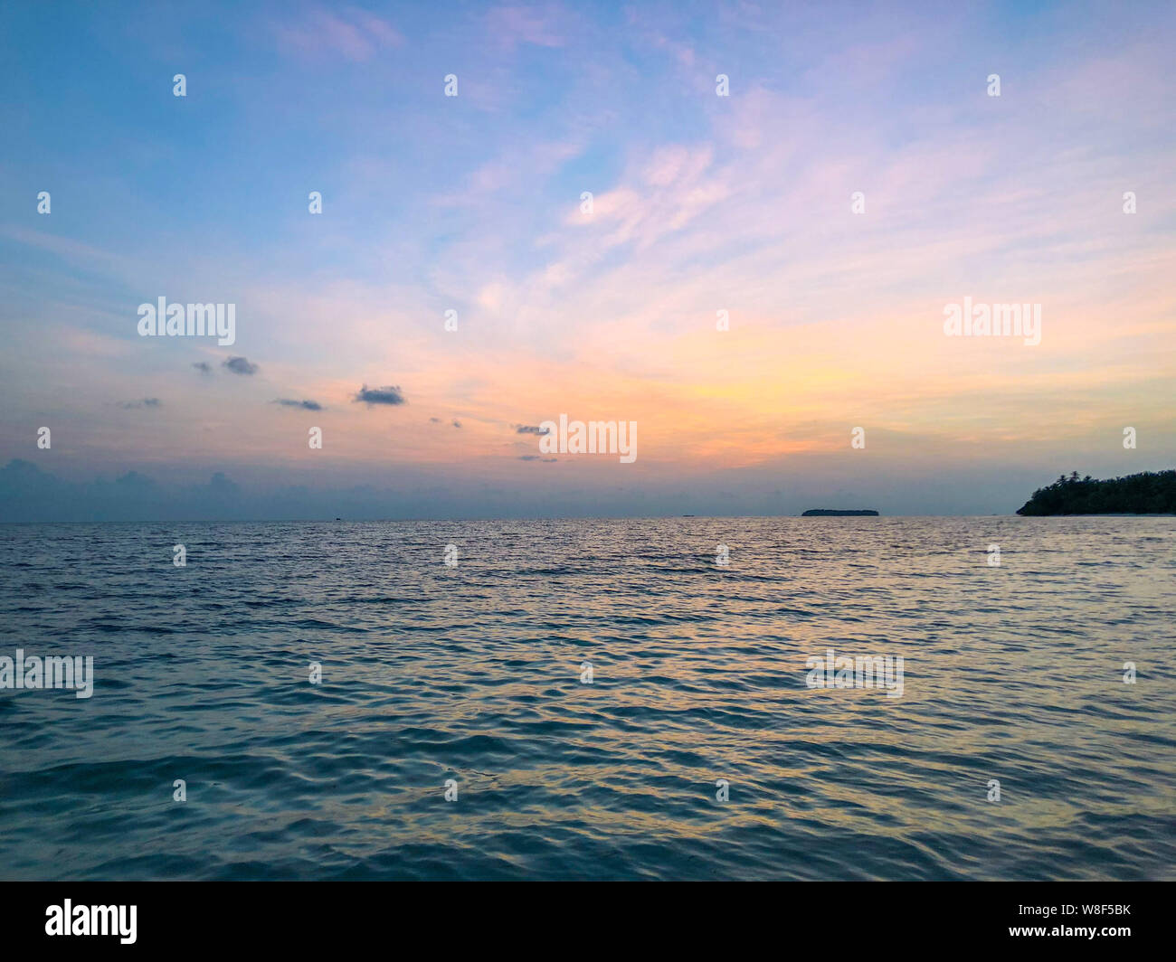 Beautyful sunset in the ocean on Fehendhoo island, Maldives Stock Photo ...