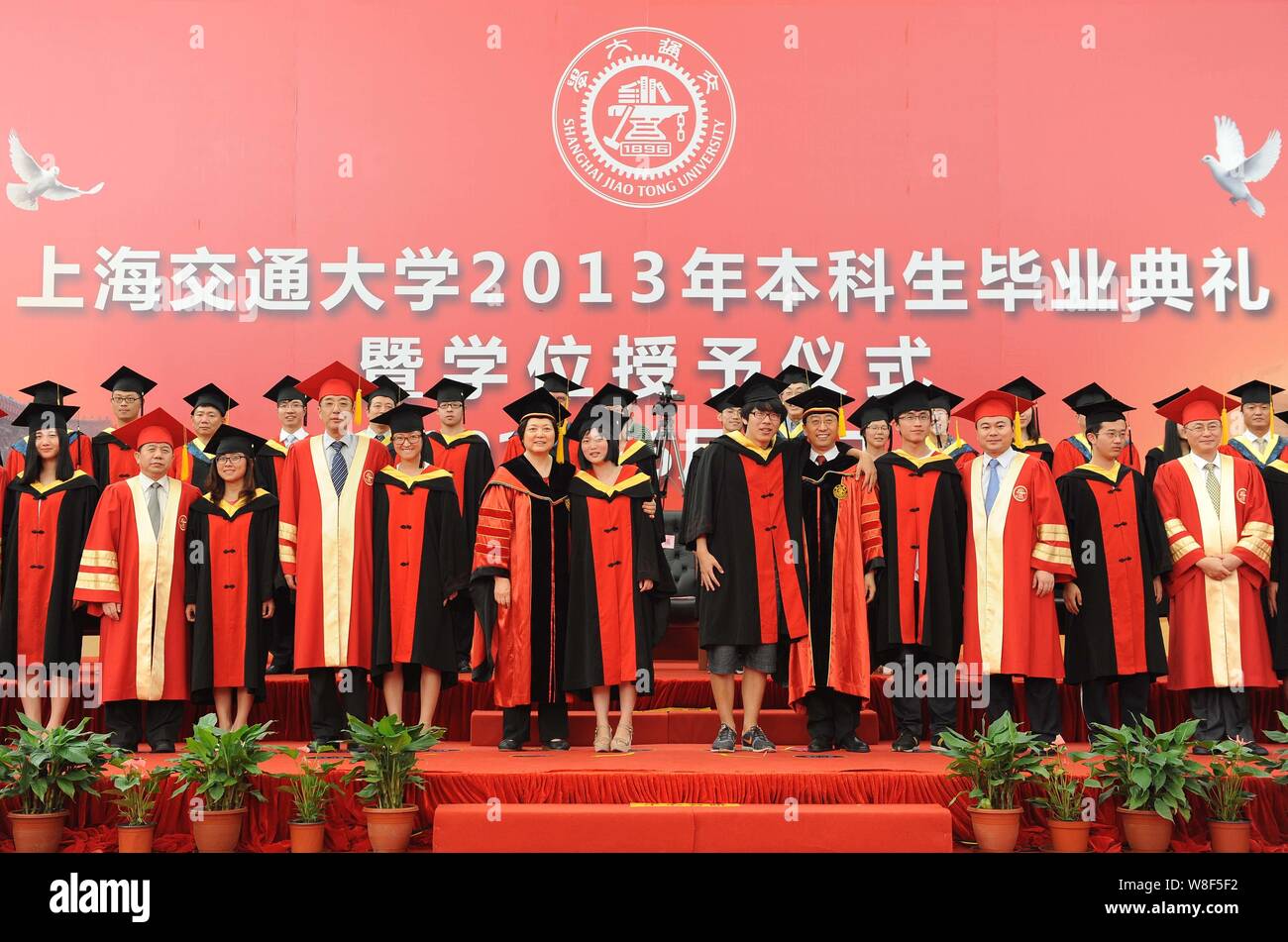 --FILE--Students pose for a photo during a graduation ceremony at ...