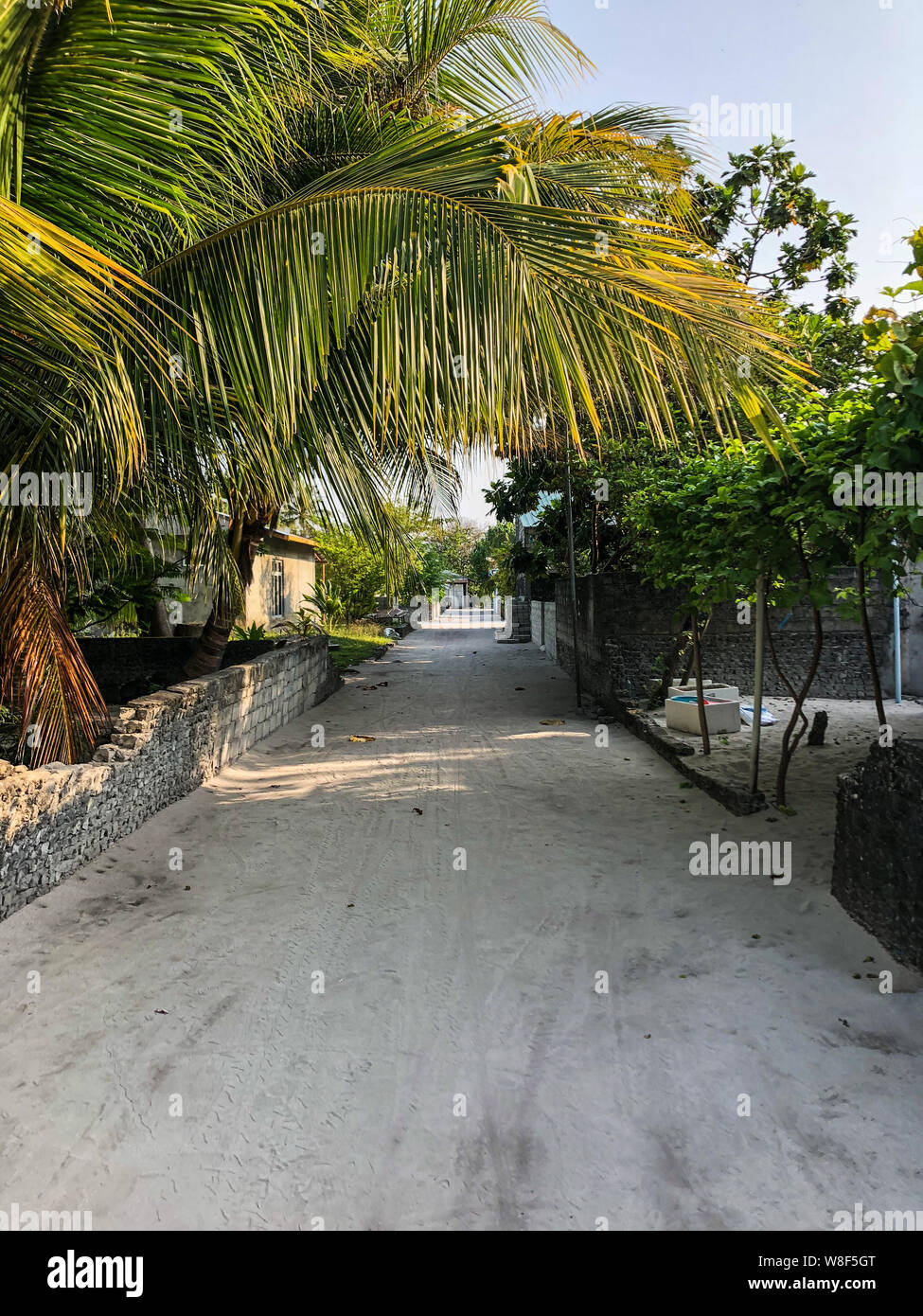 Empty street in traditional Maldivian village on Fehendhoo island, Baa ...