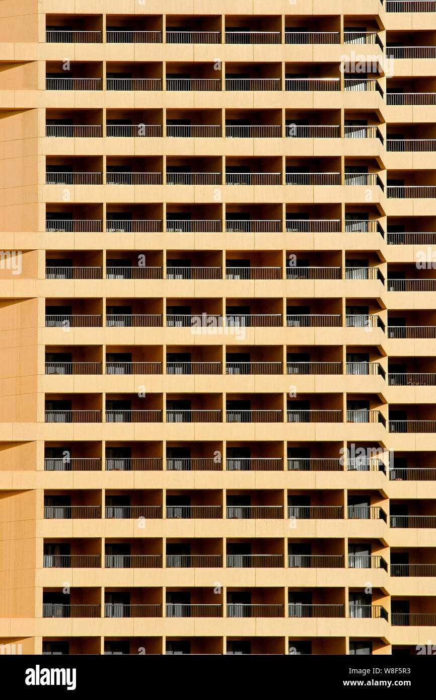 Facade with balcony at tall skyscraper residential building Stock Photo ...