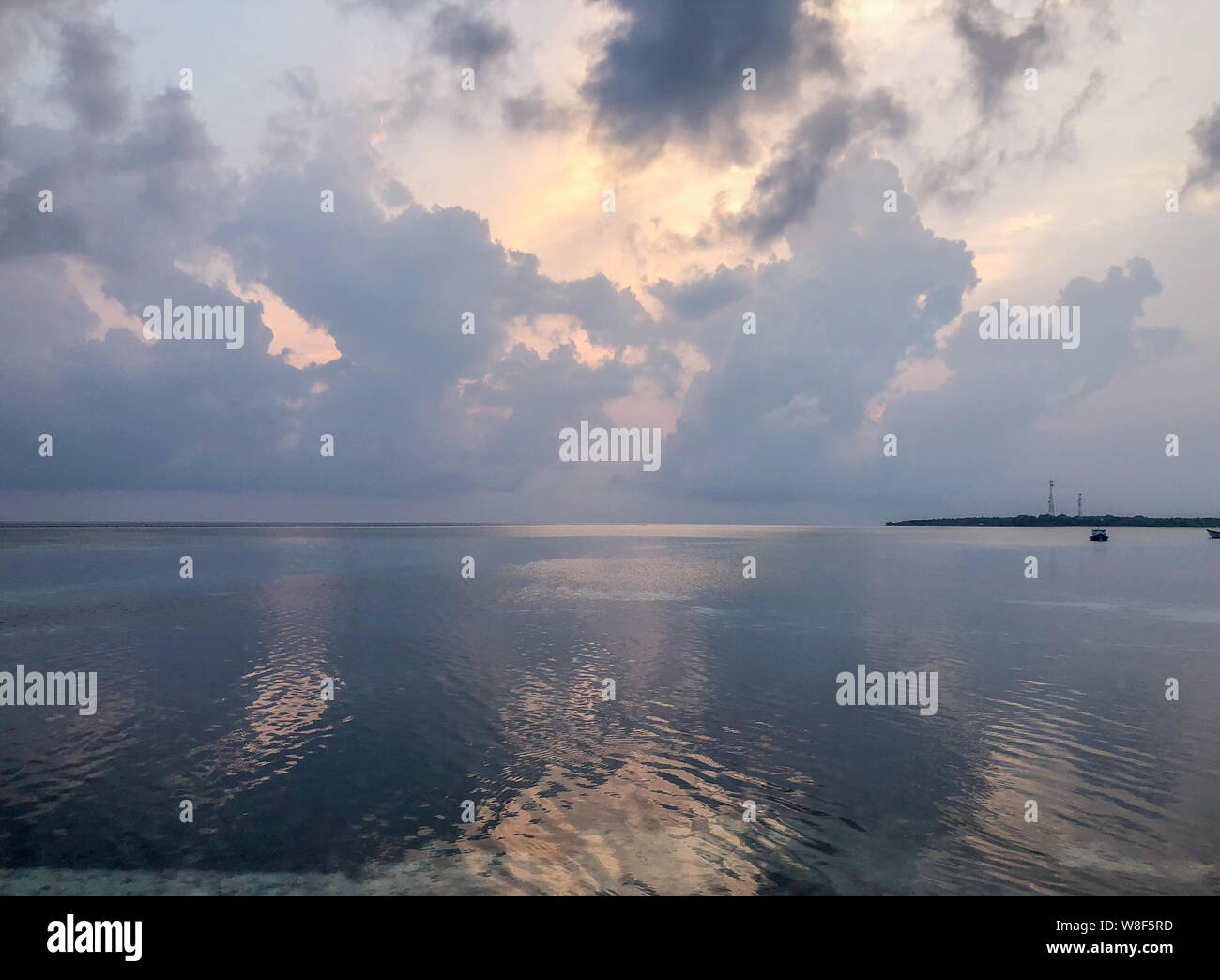 Beautyful sunset in the ocean on Fehendhoo island, Maldives Stock Photo ...