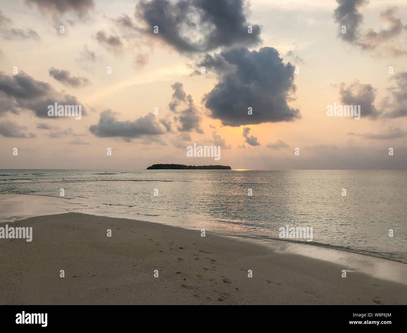 Beautyful sunset in the ocean on sandbank near Fehendhoo island ...