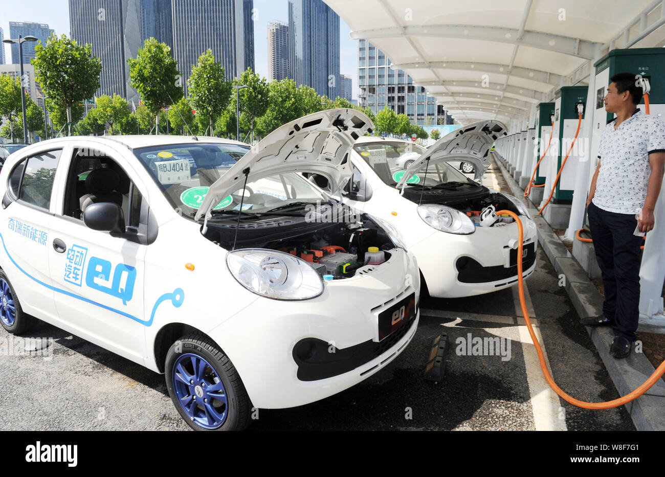 --FILE--Electric cars are being recharged at a charging station in ...