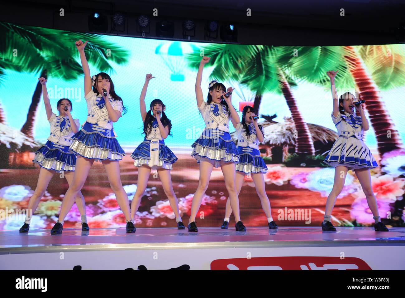 Members of Chinese girl group SNH48 perform at a marketing event of tv ...