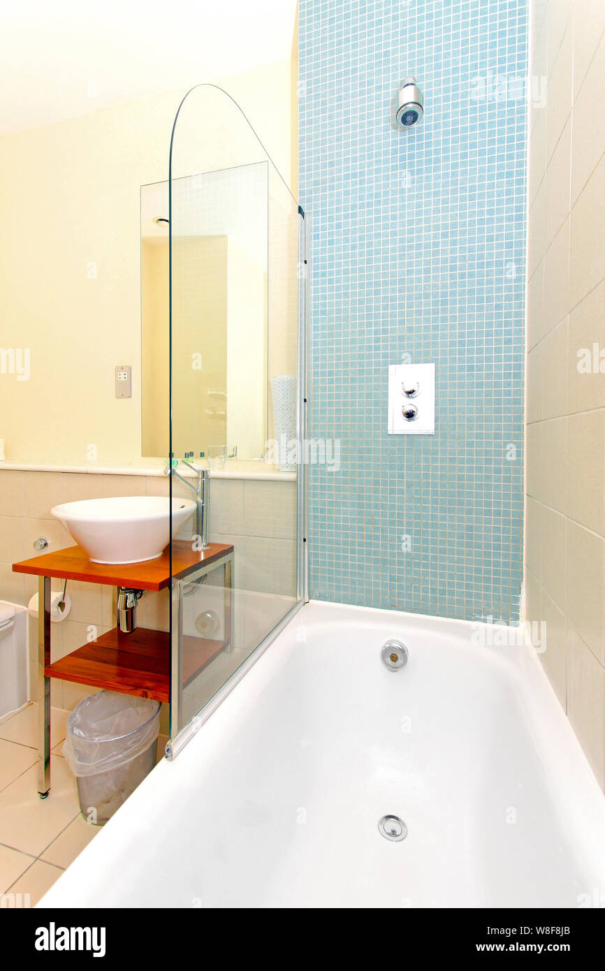 Modern clean and tidy bathroom with bathtub Stock Photo - Alamy