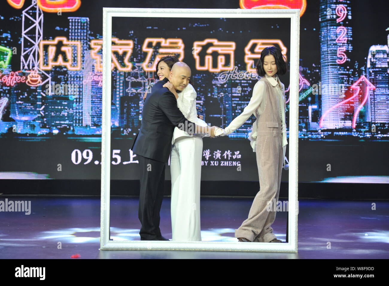 (From left) Chinese director and actor Xu Zheng interacts with actress ...