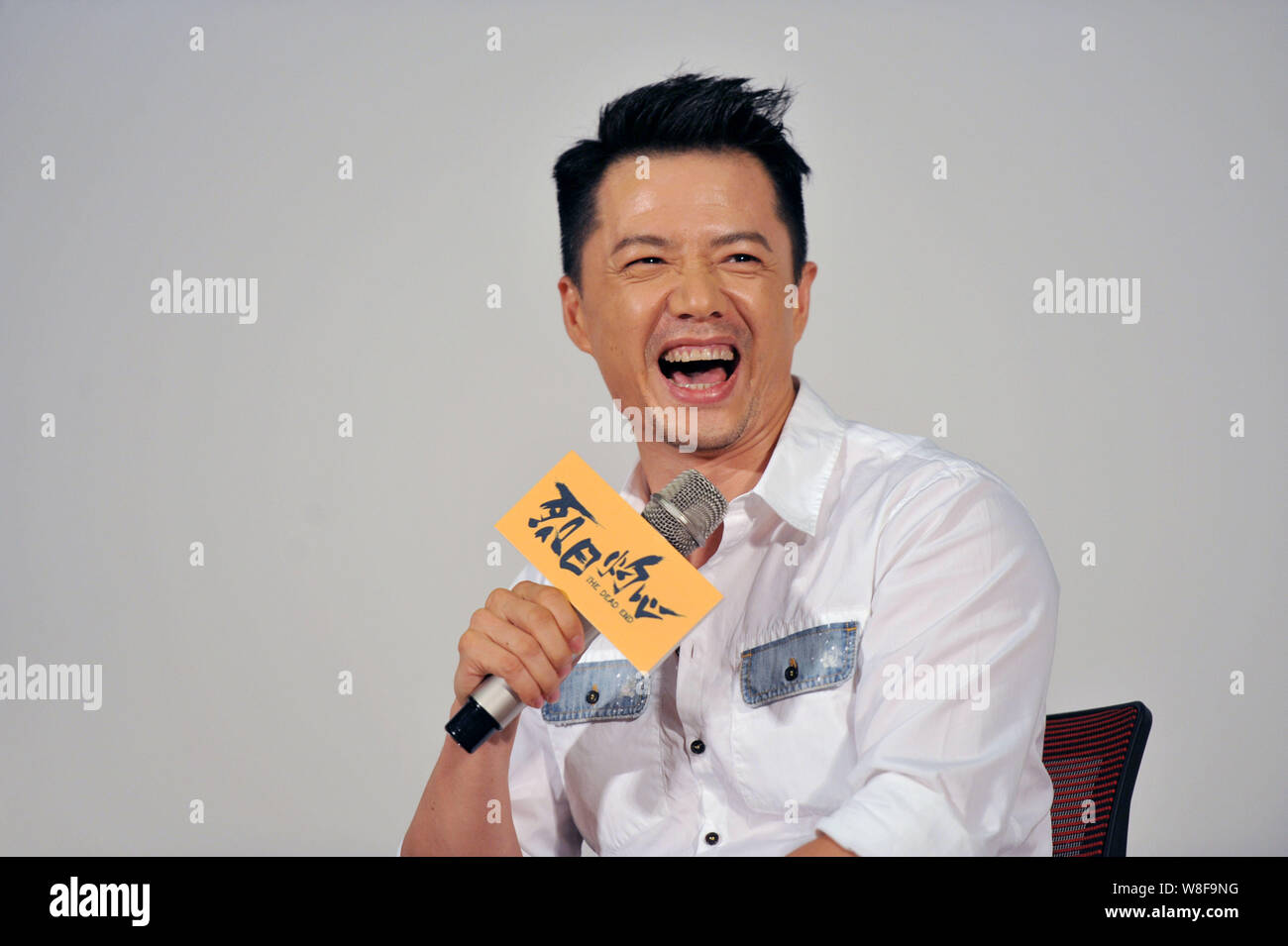 Chinese actor Duan Yihong reacts at a promotional event for his new ...